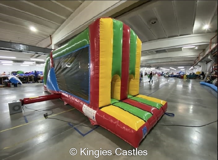 Rainbow themed bouncy castles and inflatables